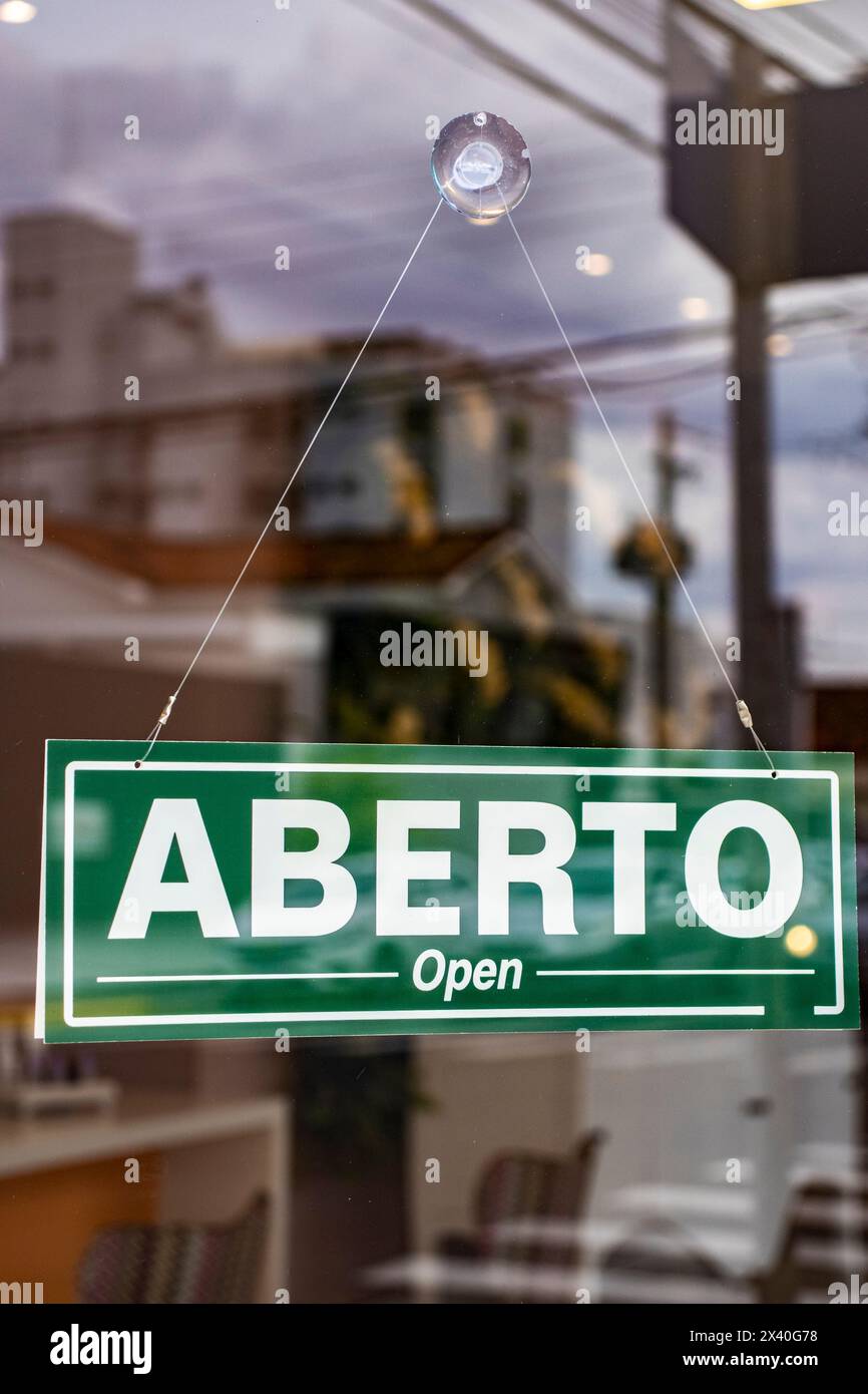 Bilingual sign with the words Aberto and Open in Portuguese and English ...