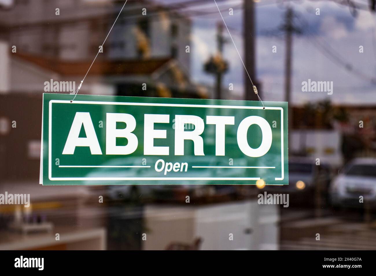 Bilingual sign with the words Aberto and Open in Portuguese and English ...