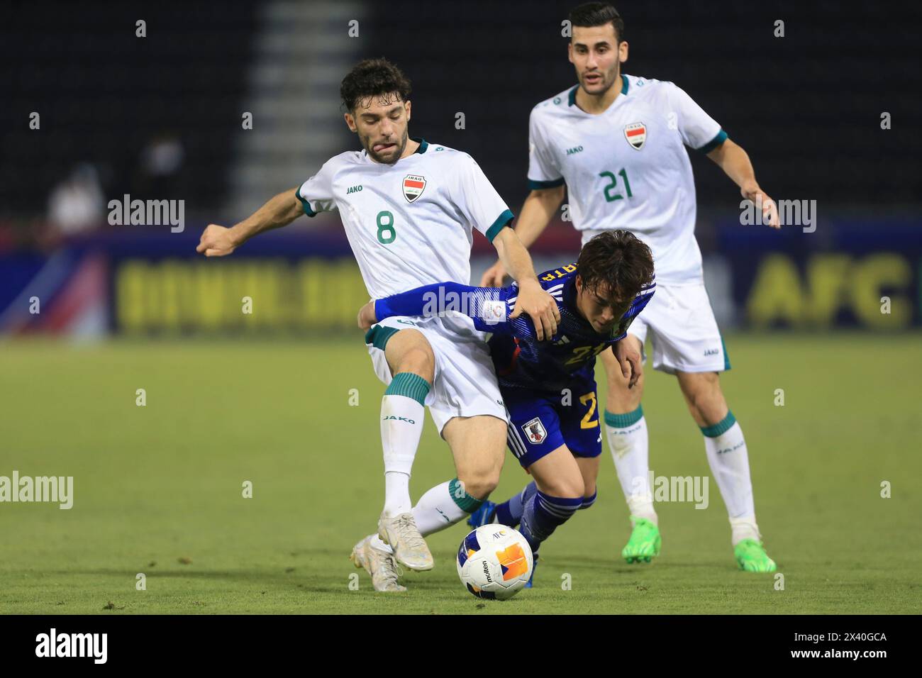 Iraq's Ali Basim Mohamed, left, and Japan's Riku Handa fight for the ...