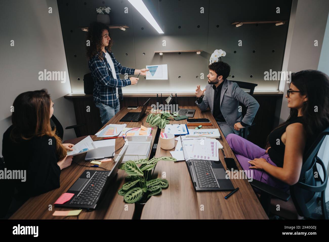 Dynamic business meeting in a modern office with diverse colleagues ...