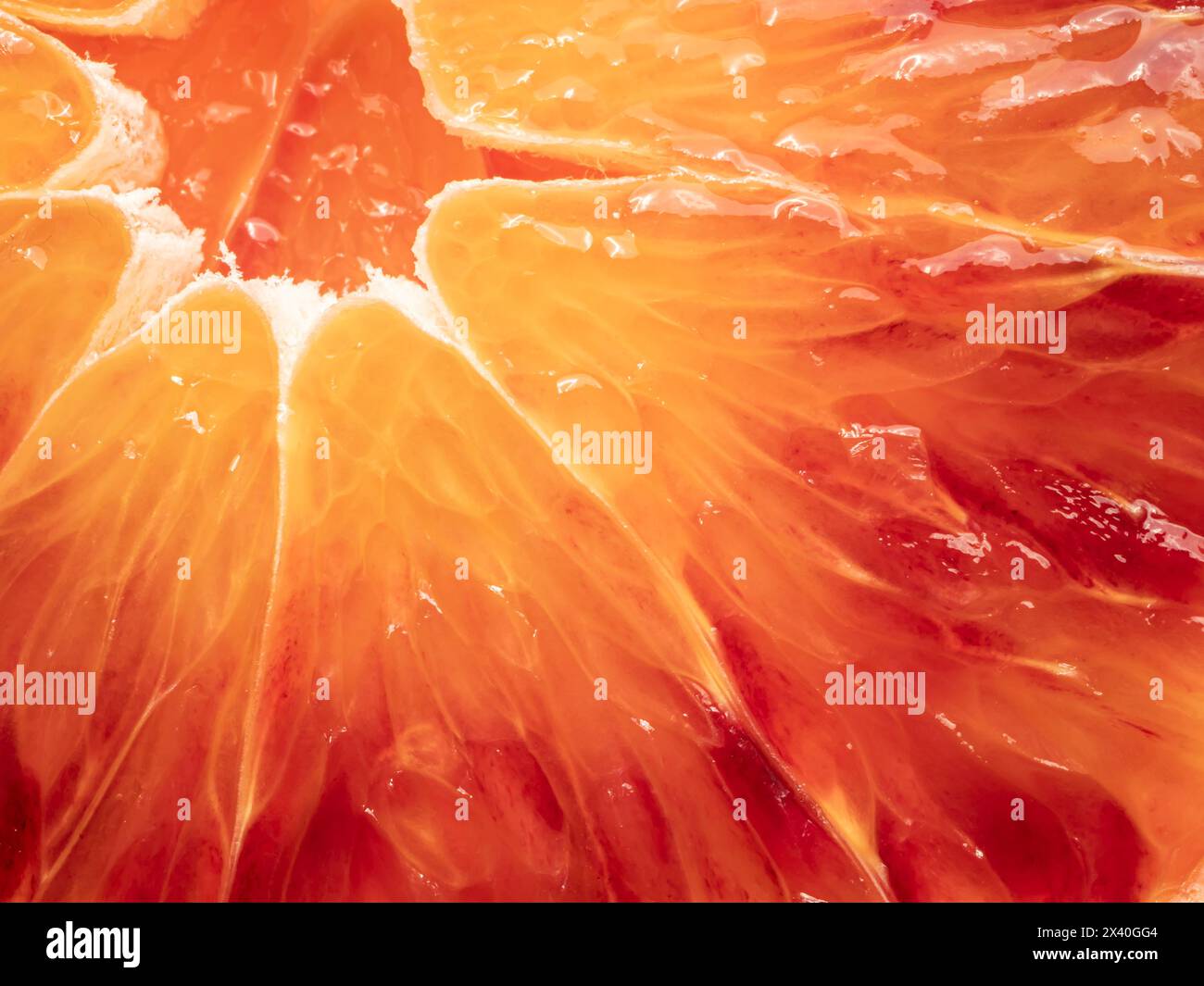 Red blood orange fruit slice, extreme close-up Stock Photo - Alamy