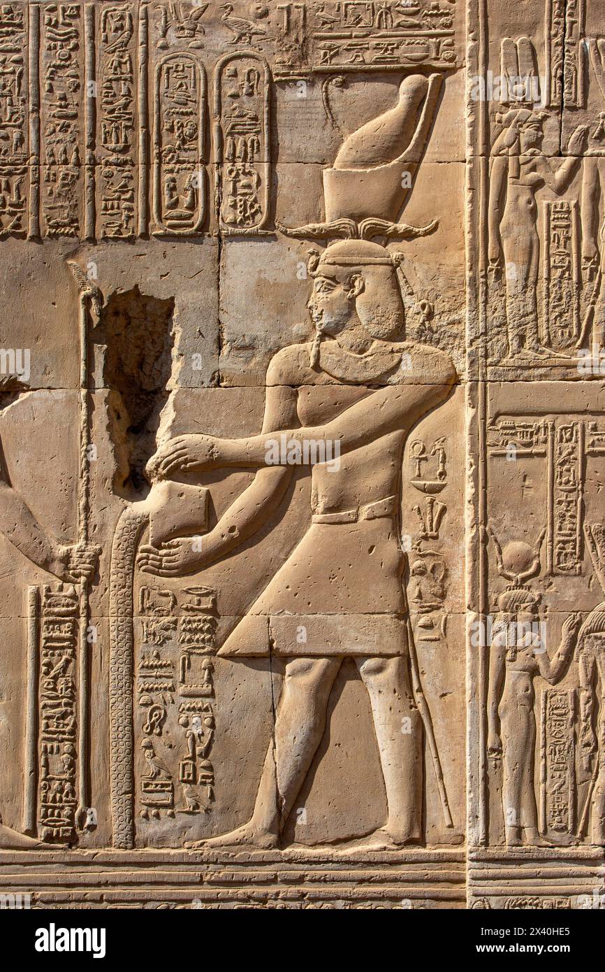 Bas-relief of a Greek king of the Ptolemaic dynasty making an offering ...
