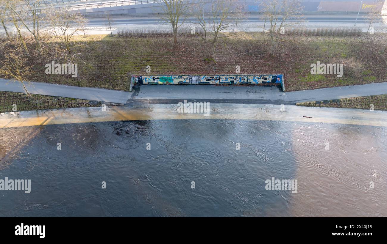 Drone photography of flooded riverside bank in a city during spring ...