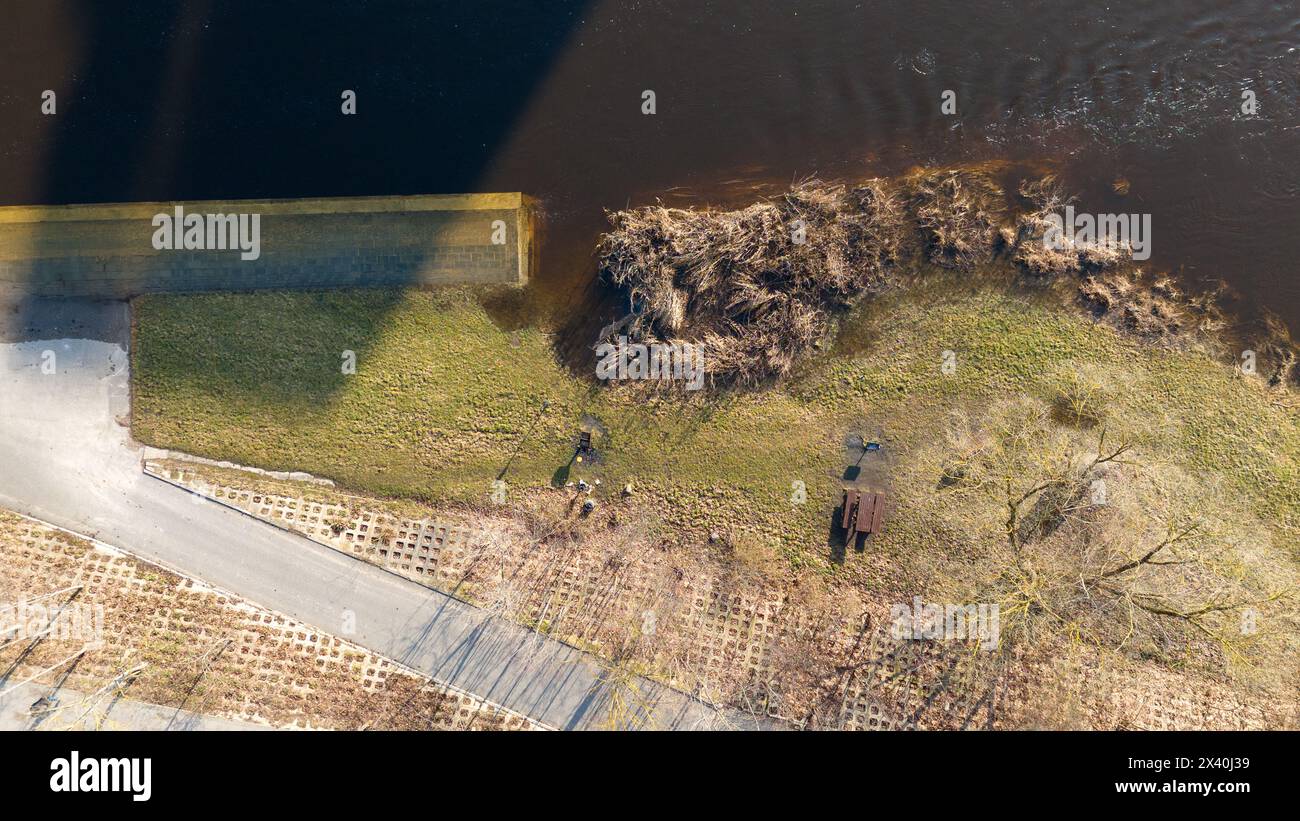 Drone photography of flooded riverside bank in a city during spring ...
