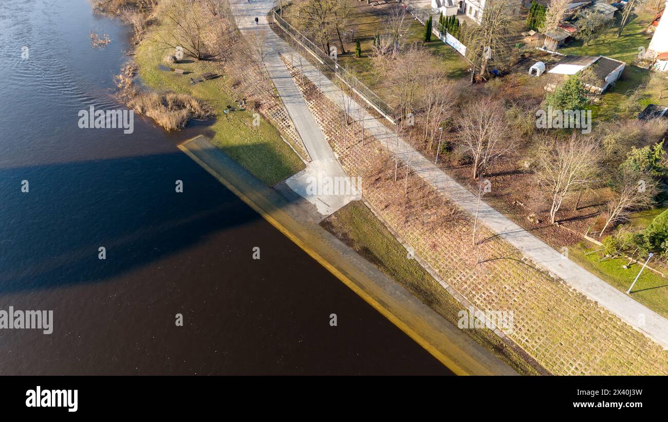 Drone photography of flooded riverside bank in a city during spring ...