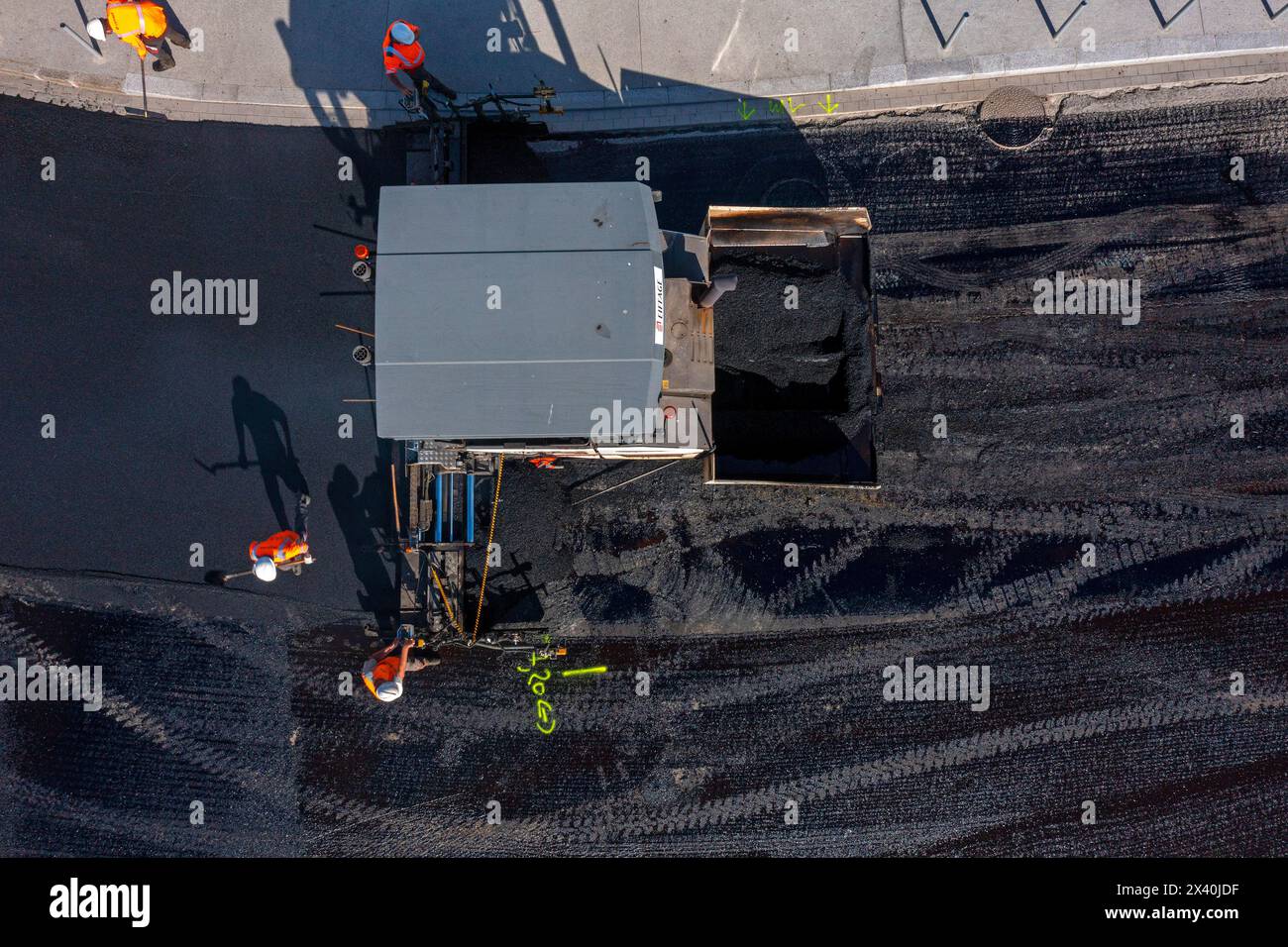 Bitumen, laying of asphalt on a road Stock Photo - Alamy