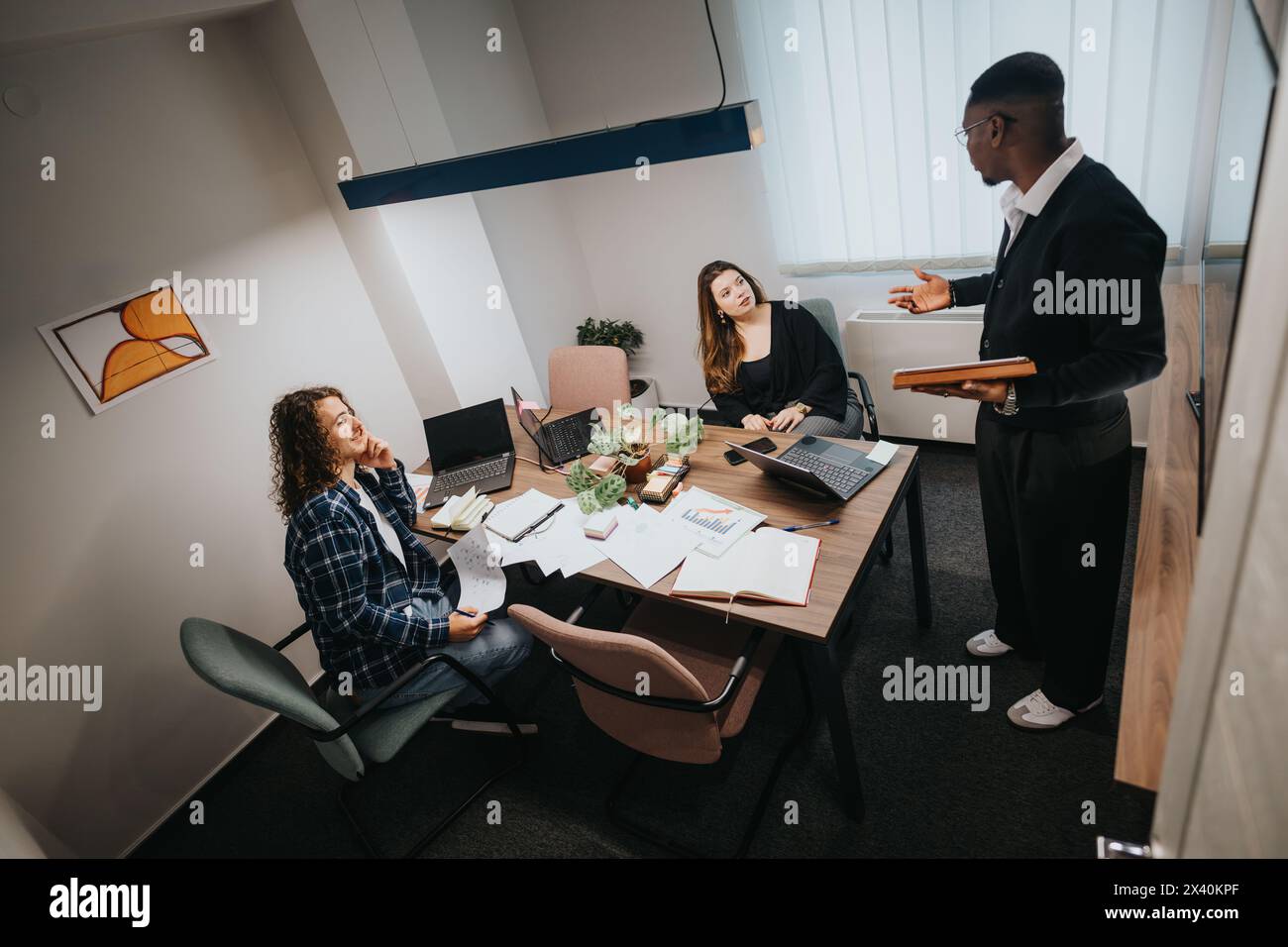 Analyzing results multicultural team hi-res stock photography and ...