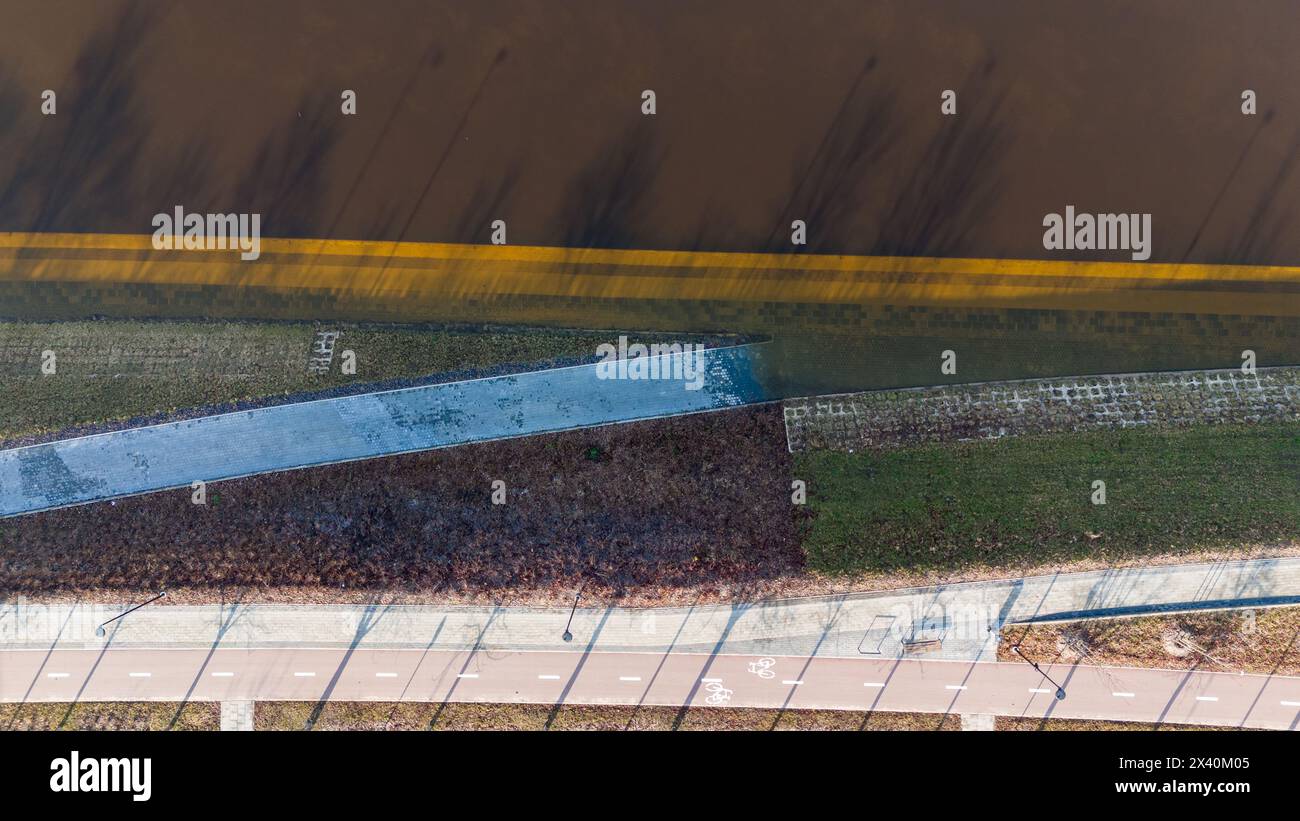 Drone photography of flooded riverside bank in a city during spring ...