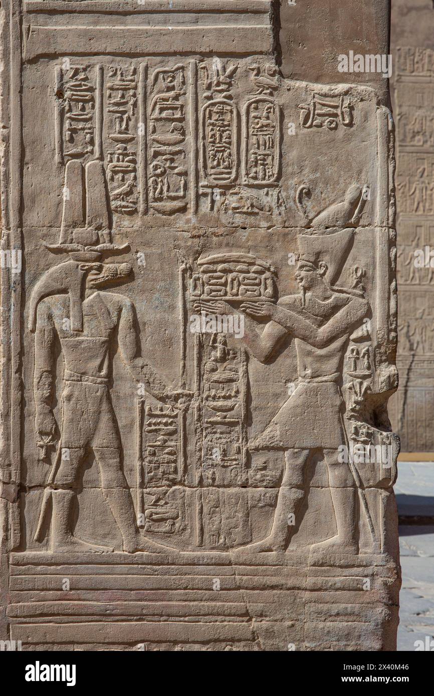 Sobek, the crocodile god, receiving an offering on a bas relief in the ...