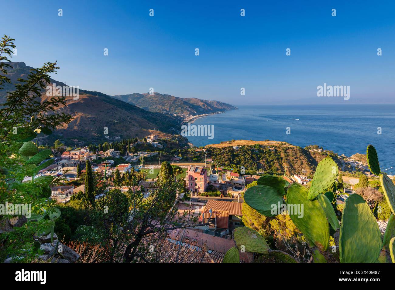 Beautiful coastline and town of Taormina, Sicily, Italy on a bright ...