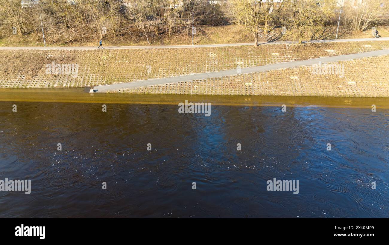 Drone photography of flooded riverside bank in a city during spring ...