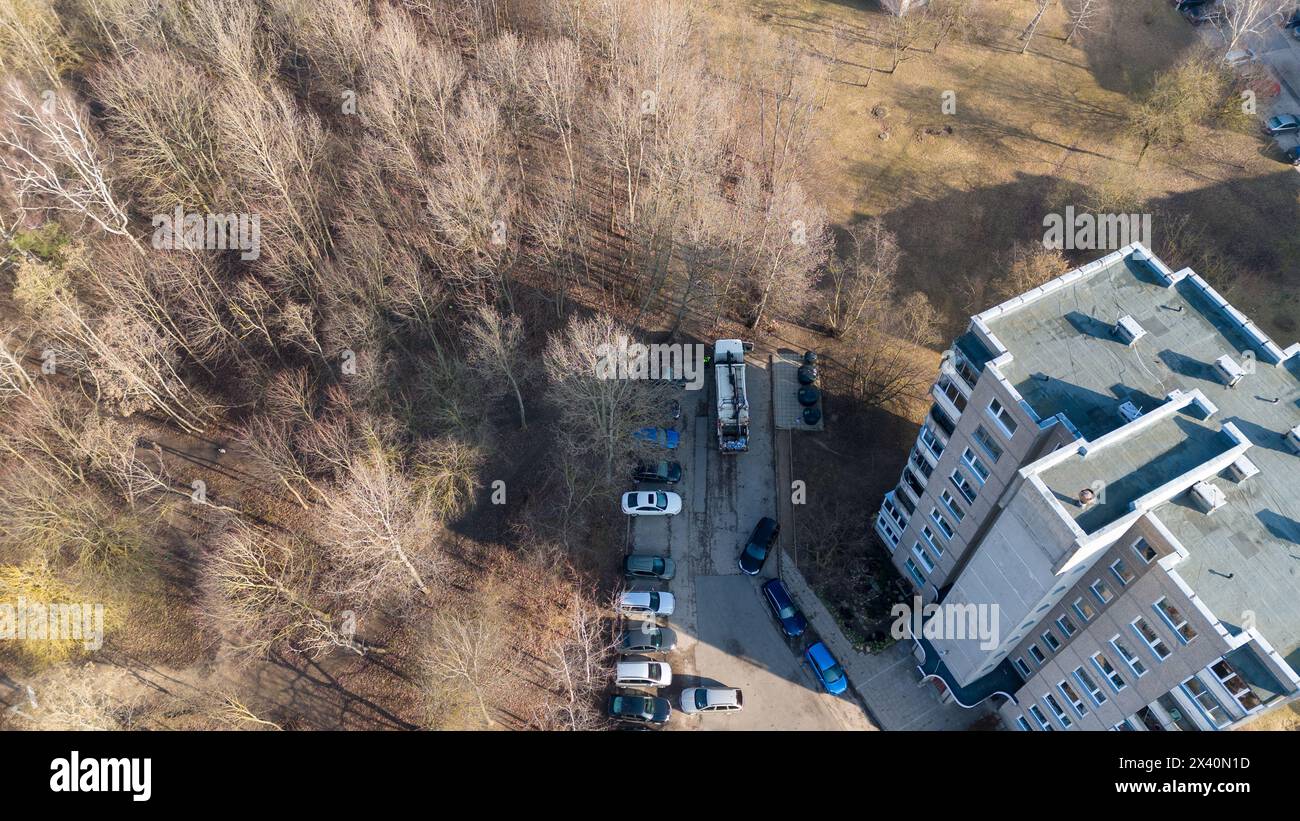 Drone photography of garbage truck picking up garbage from subterranean ...