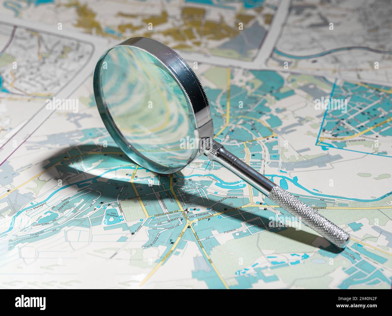 Exploring world map with magnifying glass, planning trips. Zooming in ...