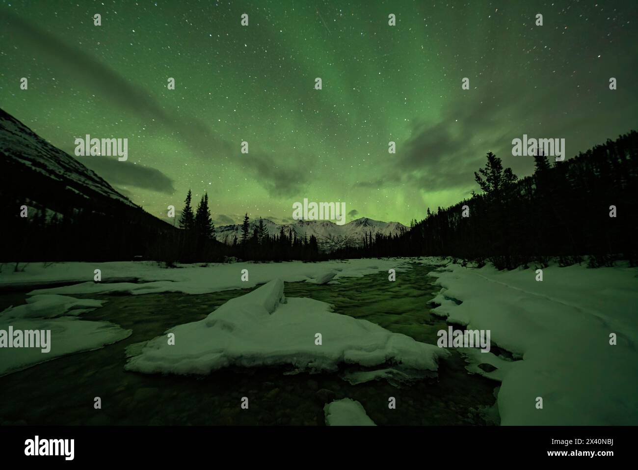 Northern lights brighten the sky above the Wheaton River, just outside ...