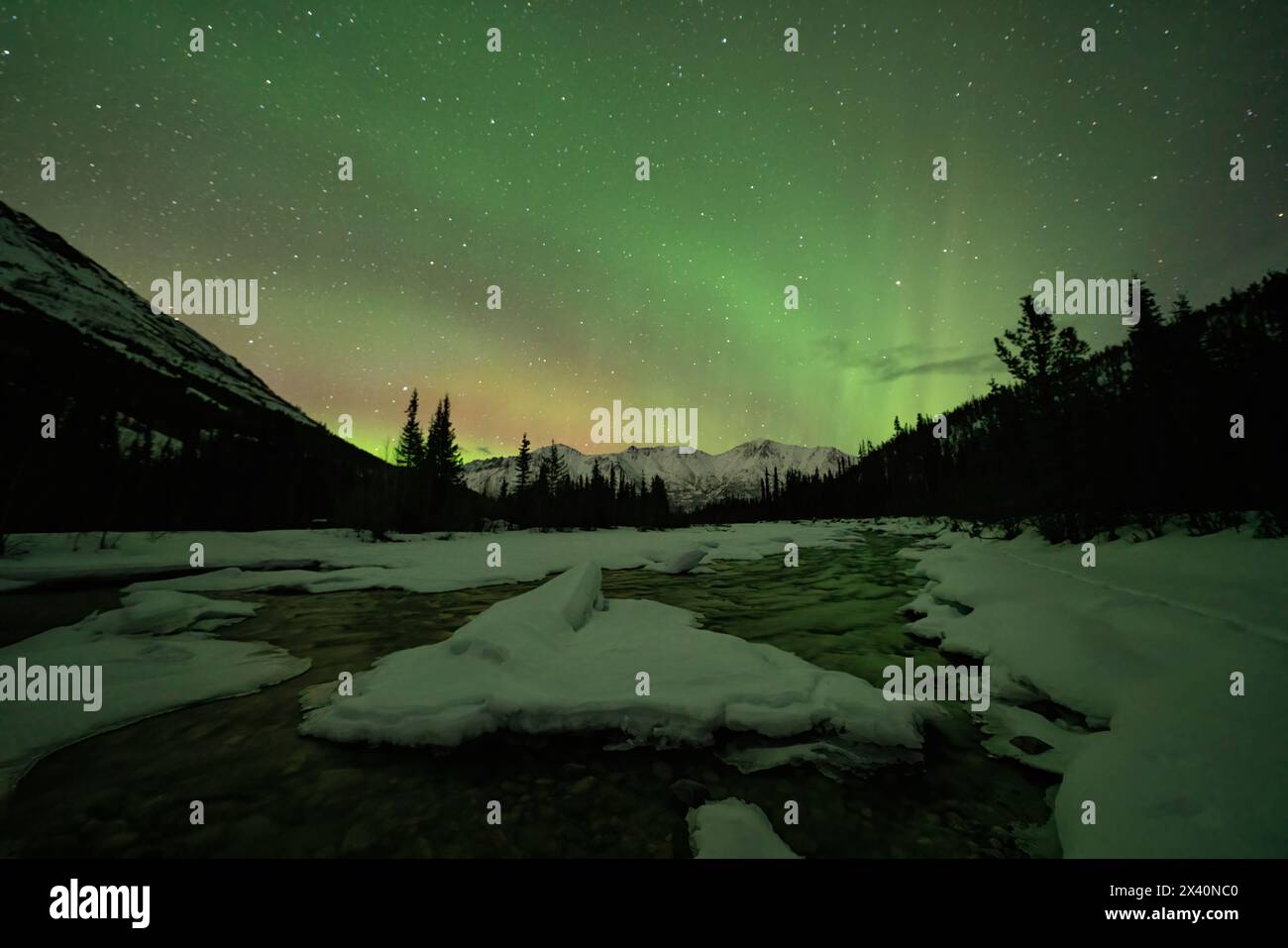 Northern lights brighten the sky above the Wheaton River, just outside ...