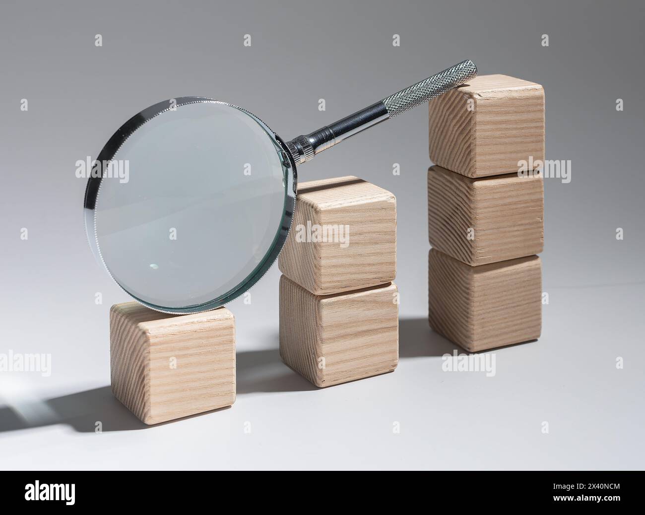 Financial graph analysis, market research with magnifying glass ...
