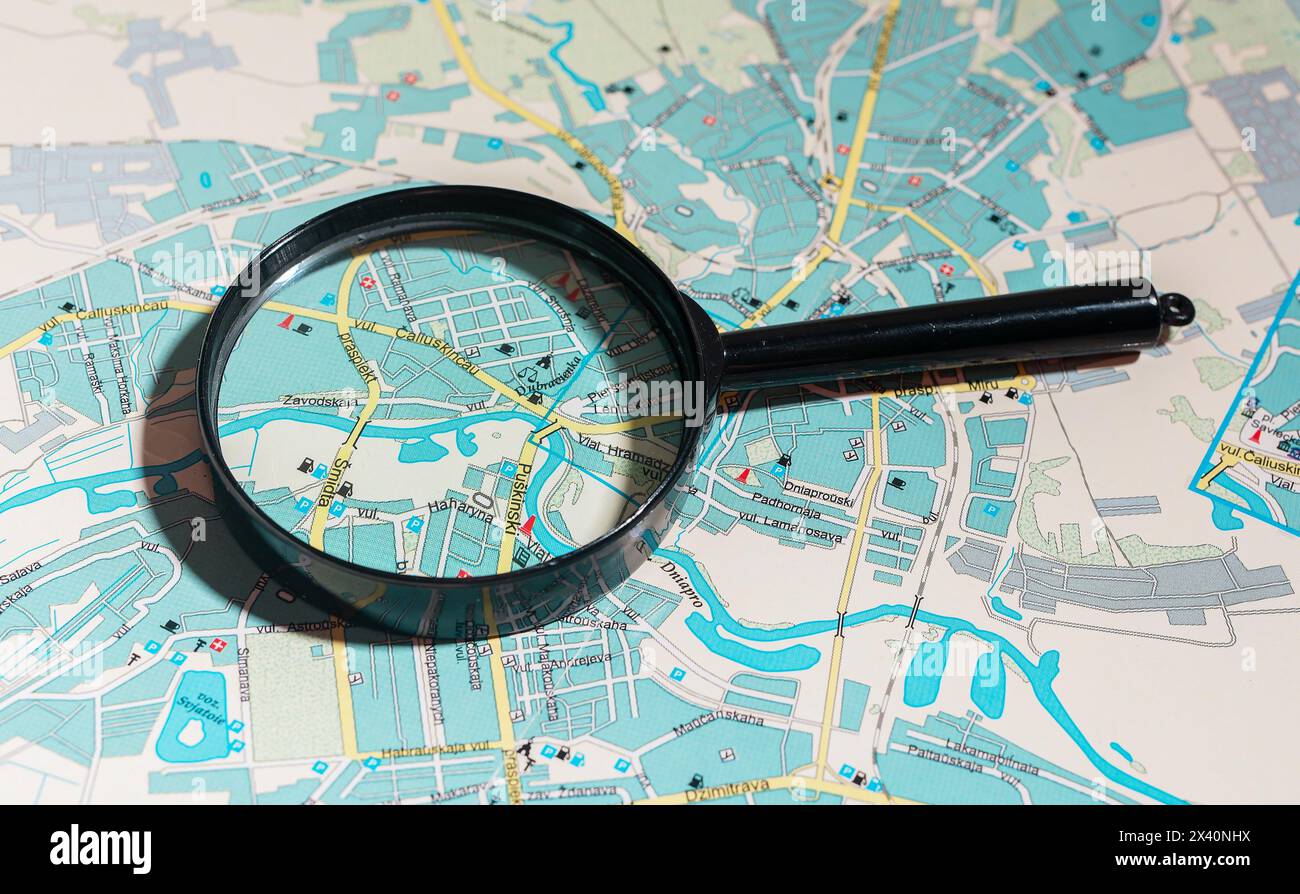 World map exploration with magnifying glass, focusing on cities ...