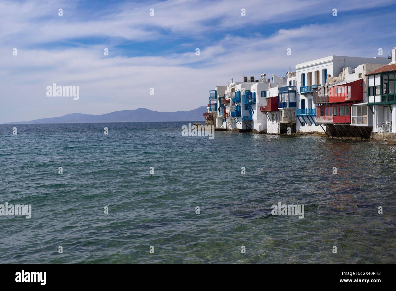 Buildings along a shoreline of a Greek Island and whitewash ...