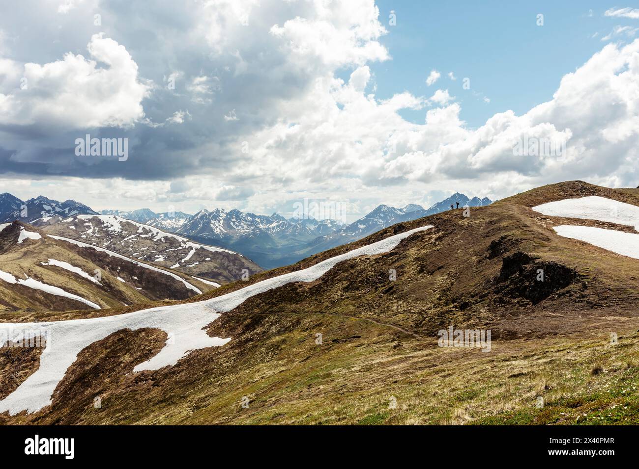 Snow on the ridges of the Chugach mountains during an Alaskan summer ...