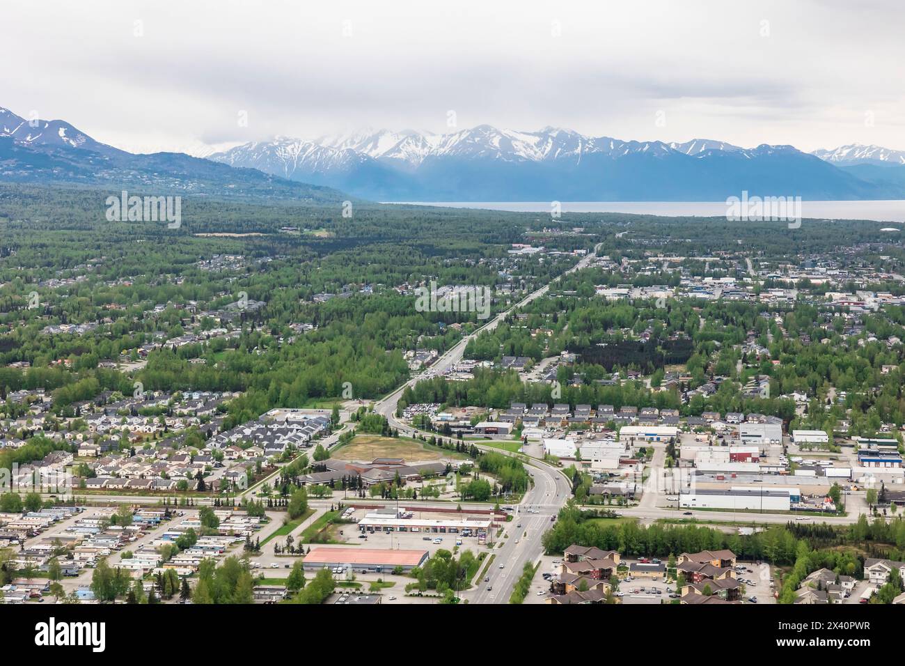 Aerial view of the city of Anchorage on a cloudy summer evening ...