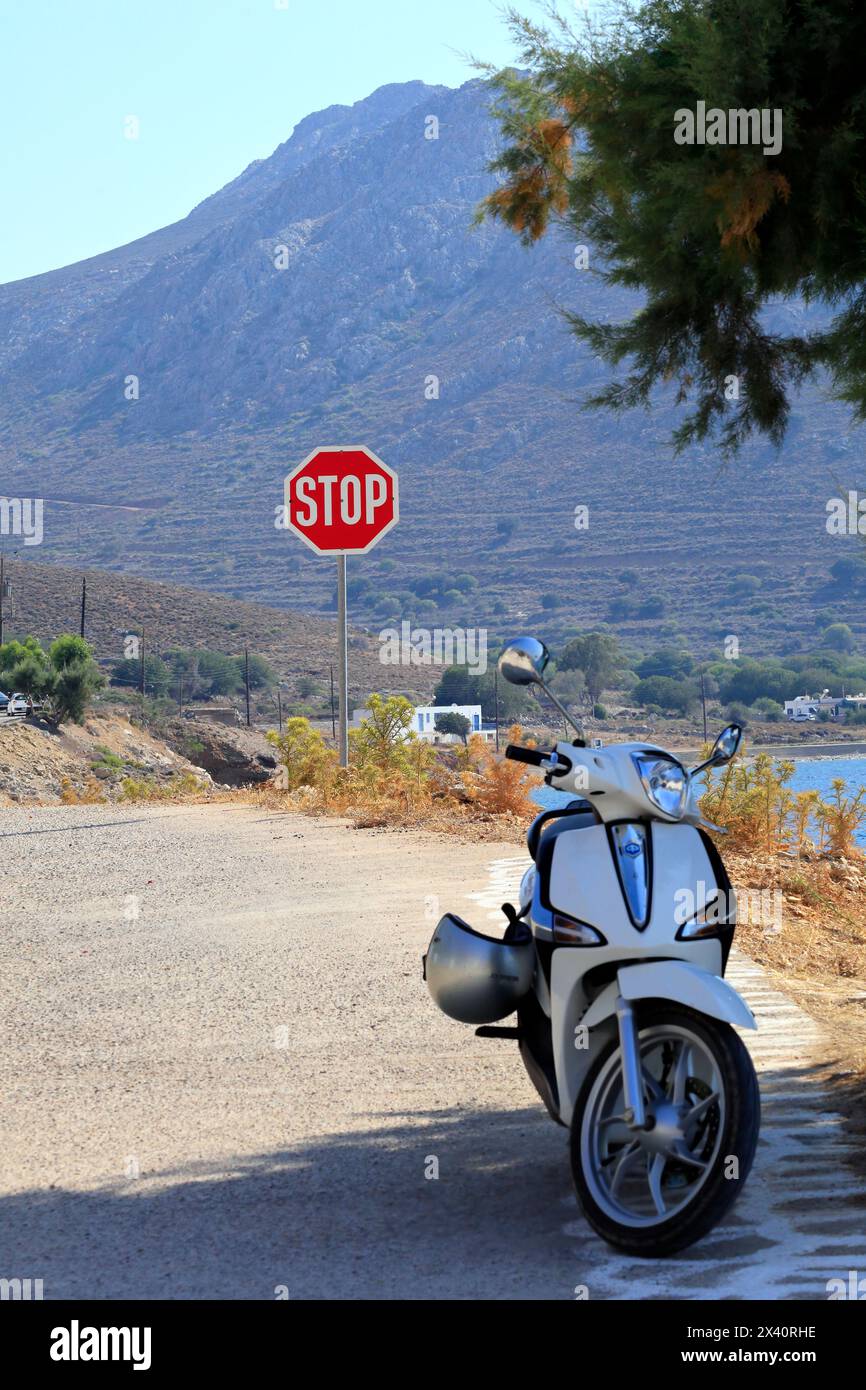 Stop sign and scooter, Greek islands, near Rhodes Stock Photo - Alamy