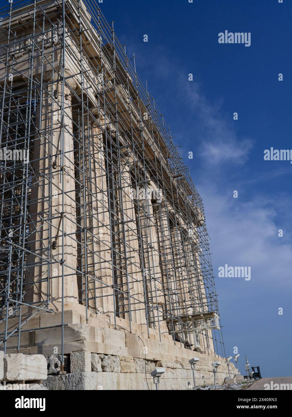 Scaffolding covers the colonnade of the ancient architecture at the ...
