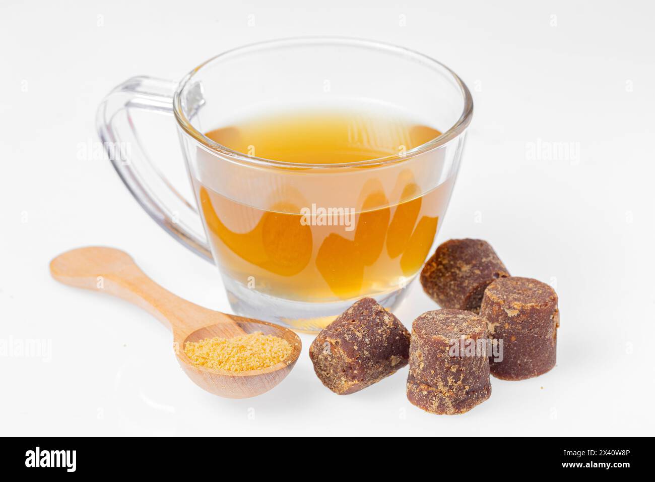 Piloncillo, ground piloncillo and piloncillo tea isolated on white ...