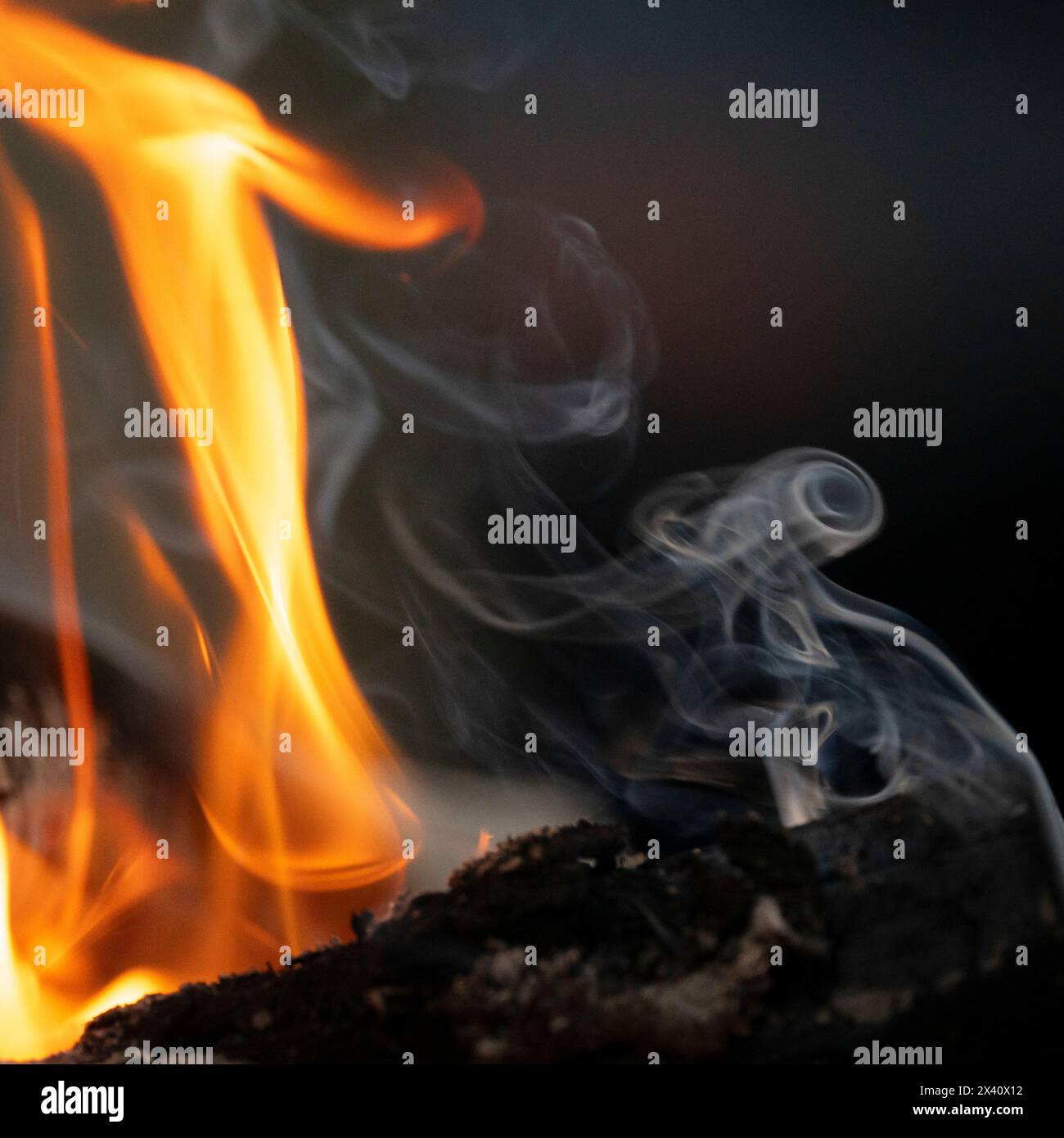 Smoke and flames from a campfire; Lake of the Woods, Ontario, Canada ...