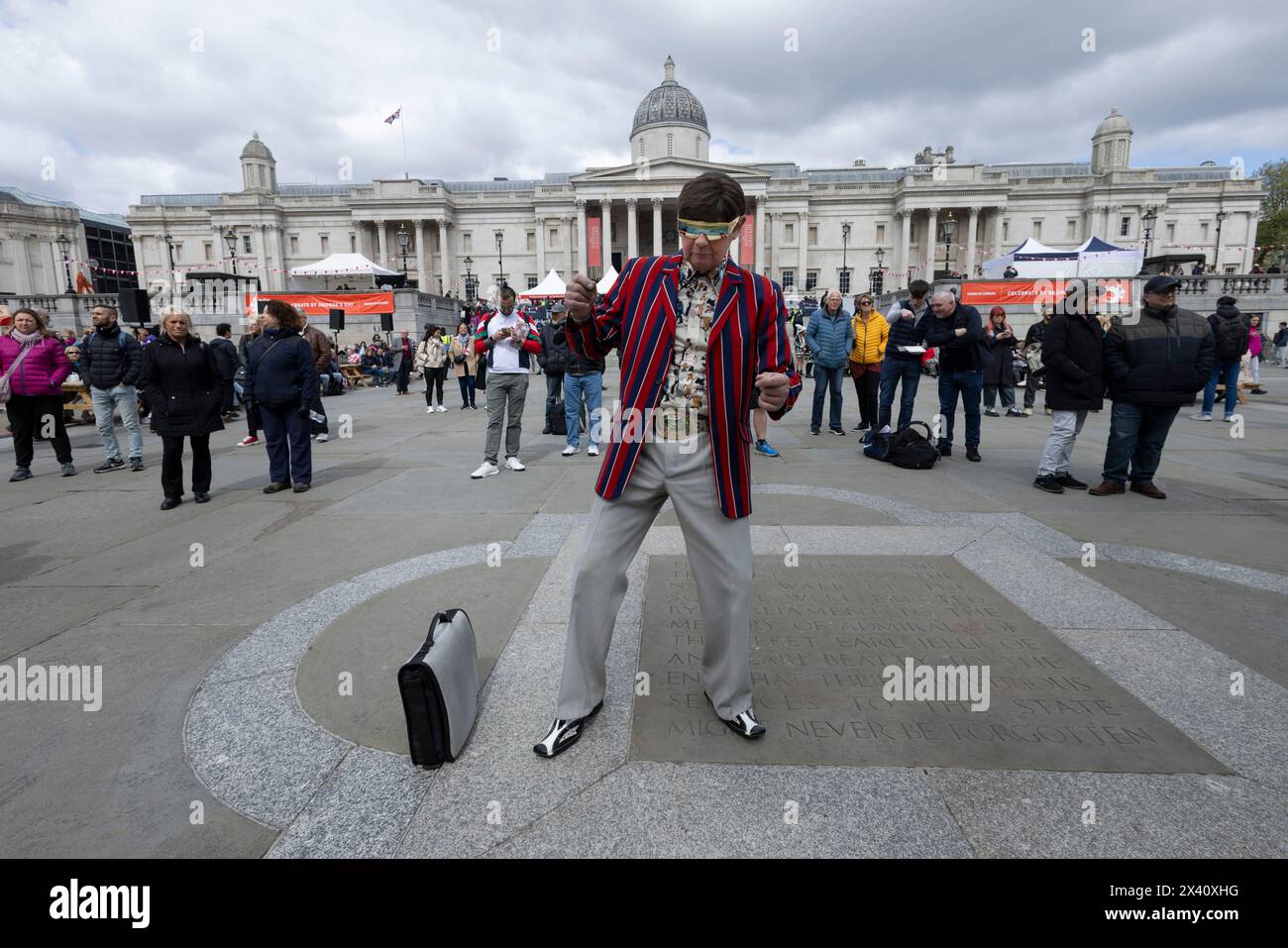 Man dressed in 1960's attire attends The Feast of St. George Festival ...