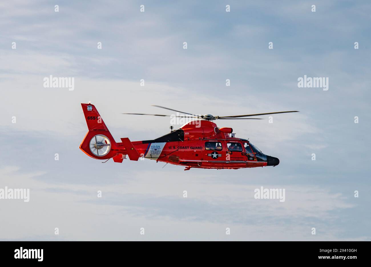 U. S. Coast Guard crew and Eurocopter MH-65 performing rescue training ...
