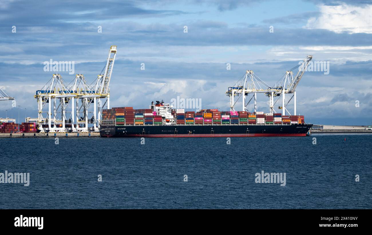 Cargo ship loaded with freight in a port; British Columbia, Canada ...