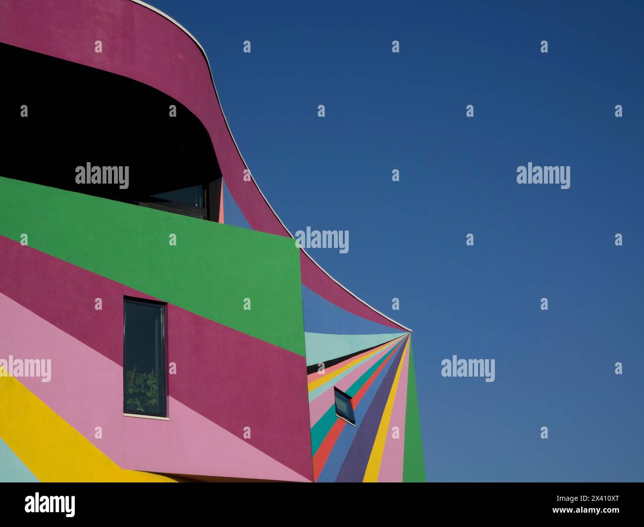 Exterior walls on an art gallery painted in vibrant colours against a ...