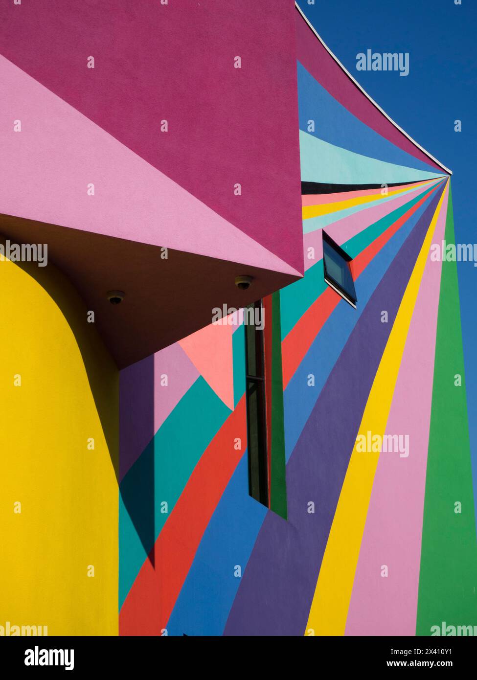 Exterior walls on an art gallery painted in vibrant colours against a ...