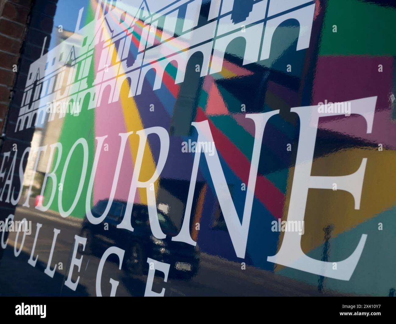 Eastbourne College wall sign with reflection of Towner Art Gallery and ...