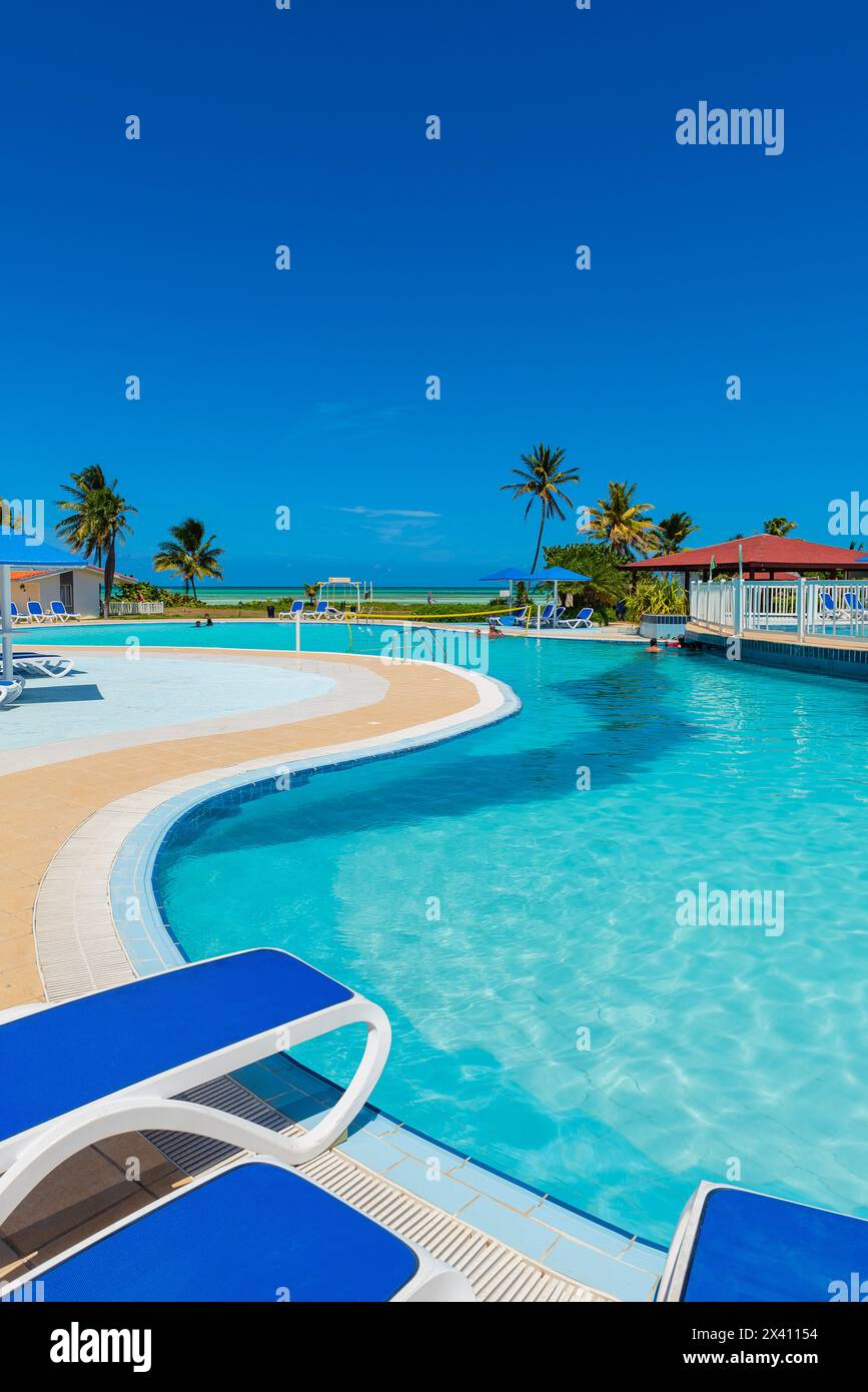 Swimming pool at a resort in the Caribbean, with a view out to the ...