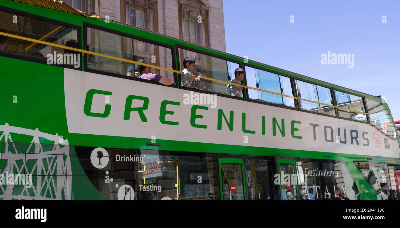 Double decker tour bus in Italy with tourists looking out the windows ...