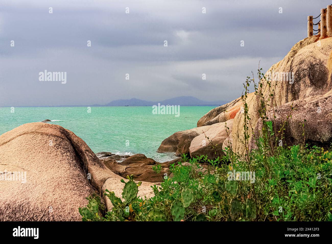 View of large rocks along the shore of the South China Sea. Sky ...