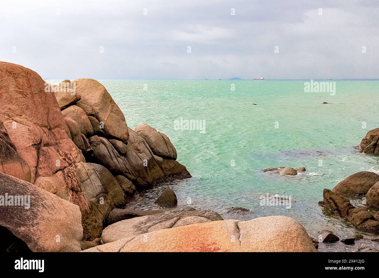 View of large rocks along the shore of the South China Sea. Sky ...