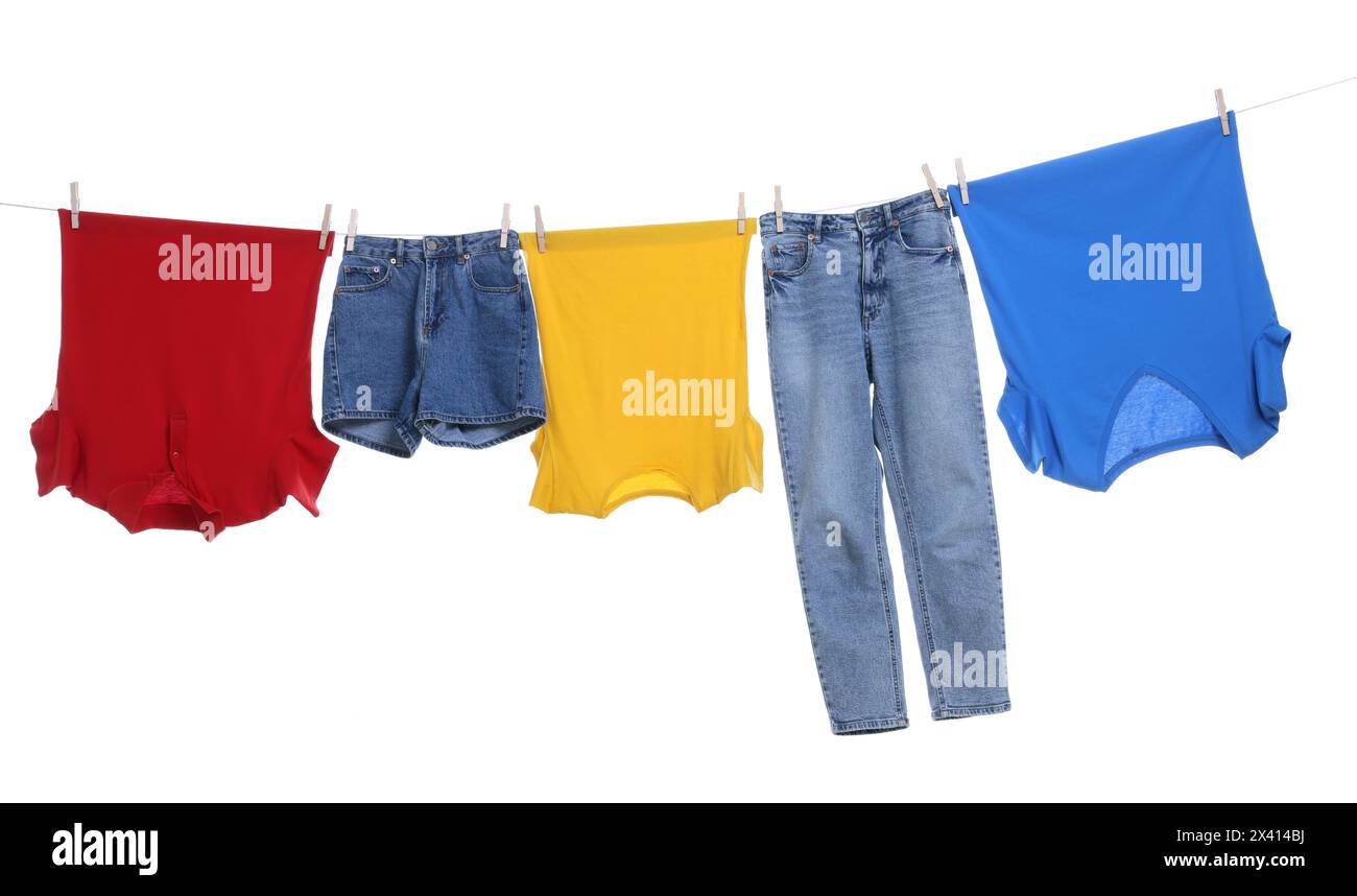 Different clothes drying on laundry line against white background Stock ...