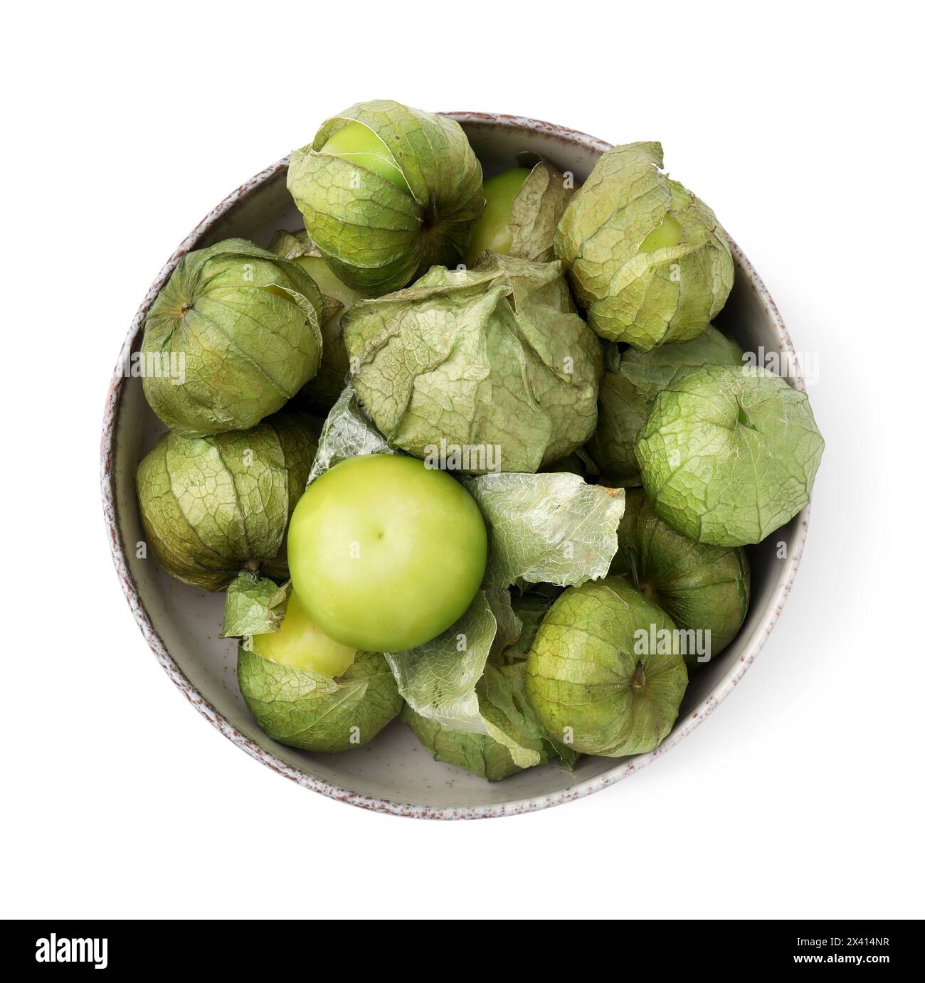 Bowl of fresh green tomatillos with husk isolated on white, top view ...