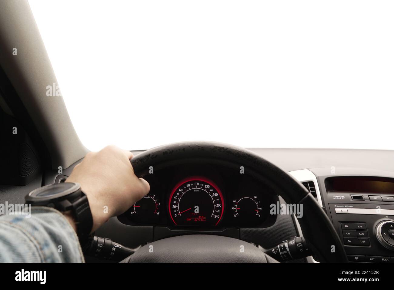 Man driving car with speedometer on dashboard, closeup Stock Photo - Alamy