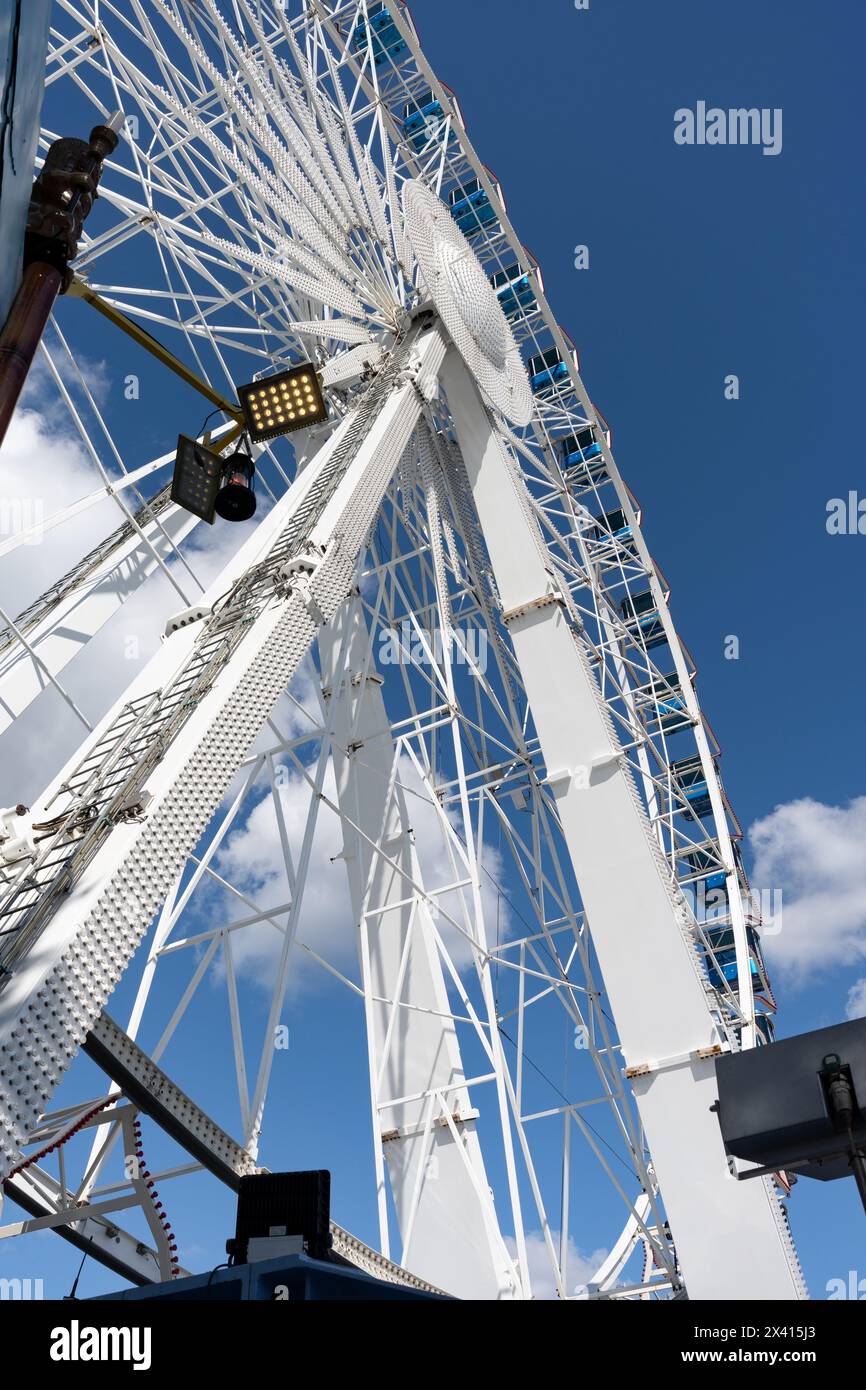 Close-up details of the Ferris wheel with metal beam guides and ...