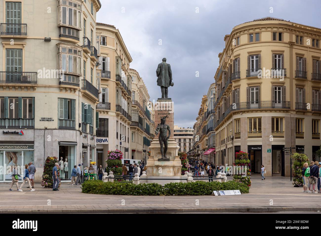 Historical building in Malaga old town with tourists walking the ...