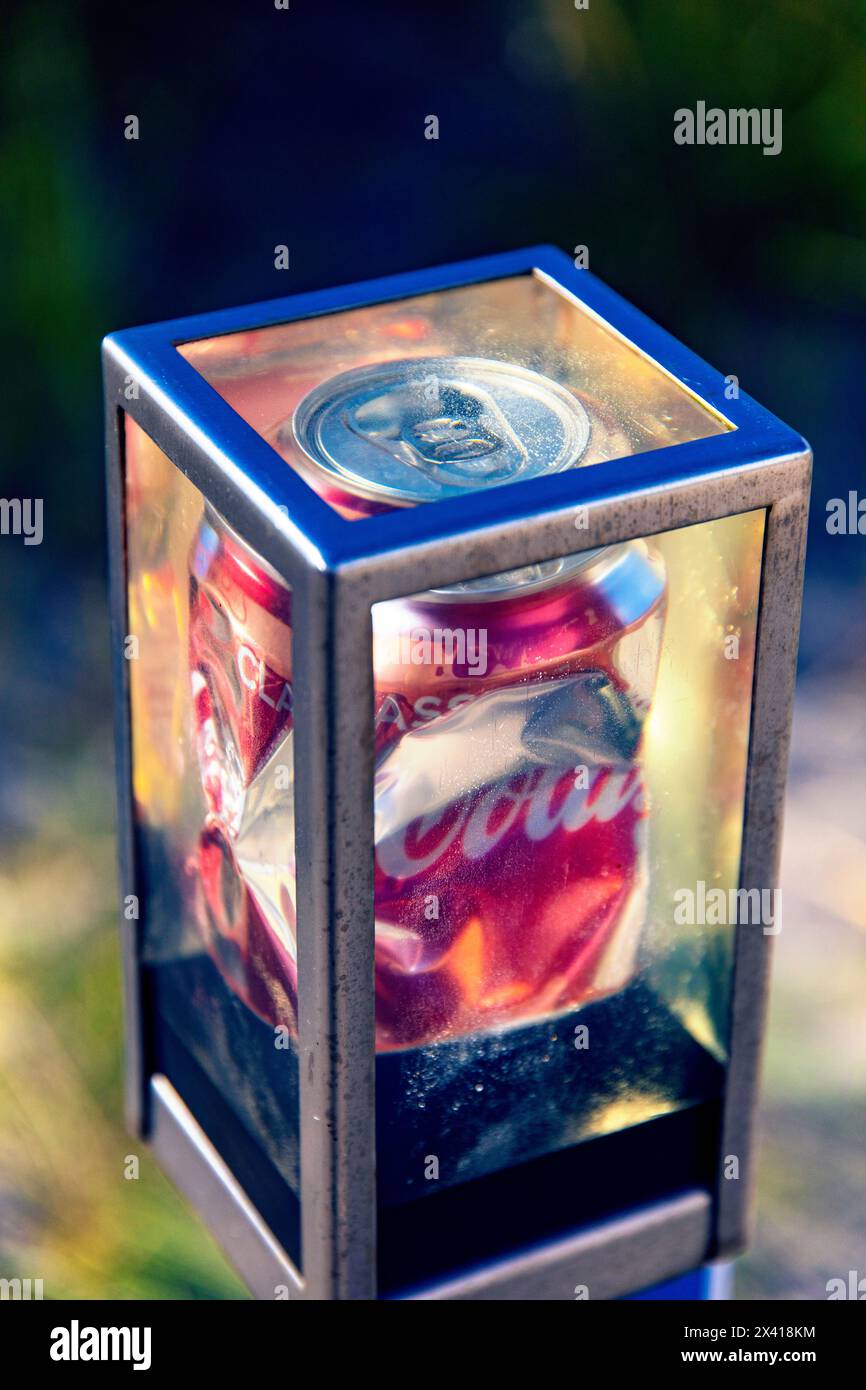 Can of Coke in a transparent crate Stock Photo - Alamy