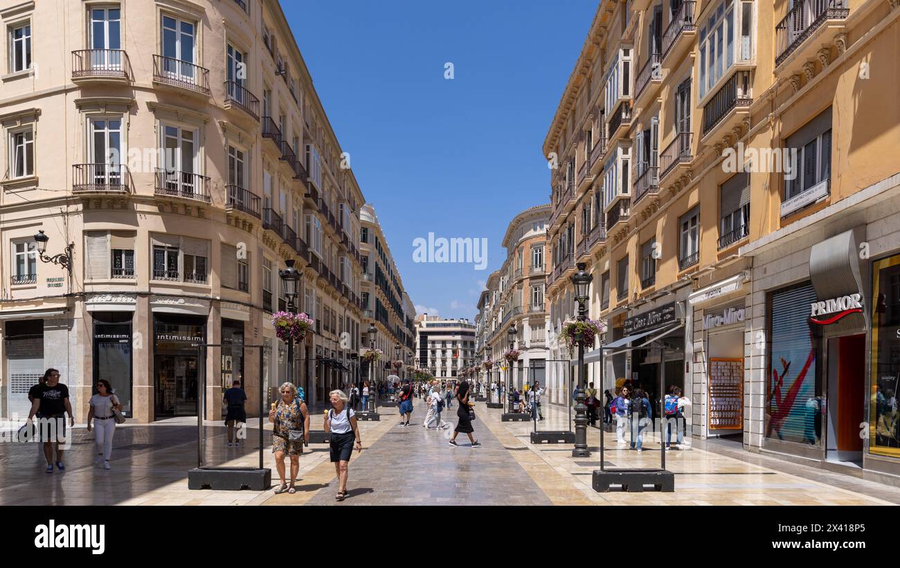 Historical building in Malaga old town with tourists walking the ...
