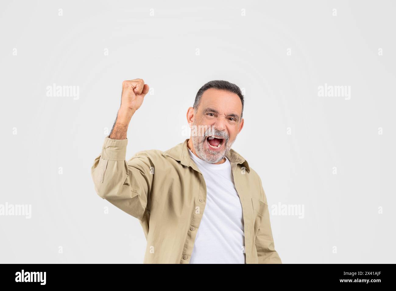 Man Raising Fist Up in the Air Stock Photo - Alamy