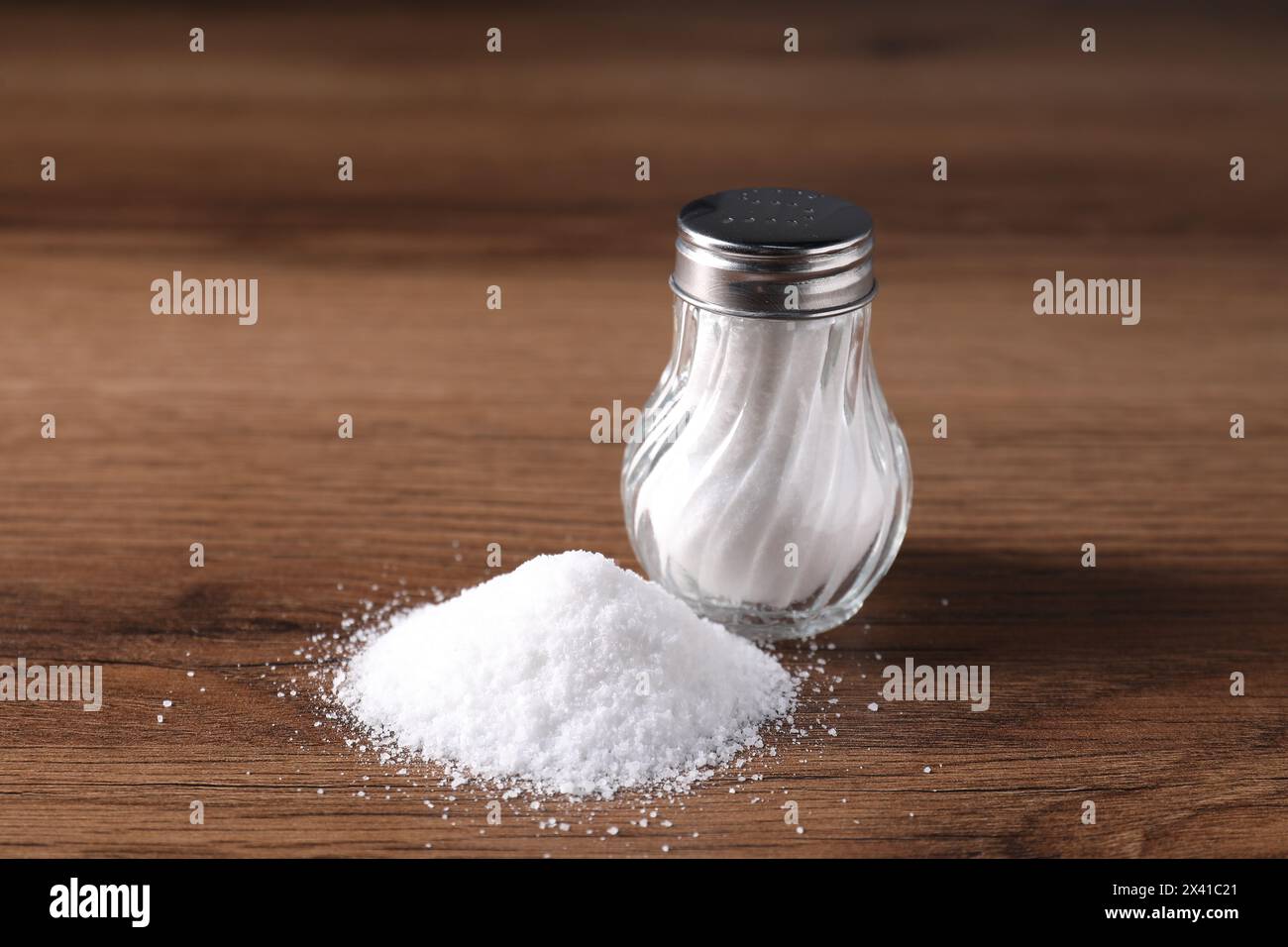 Salt shaker on wooden hi-res stock photography and images - Alamy