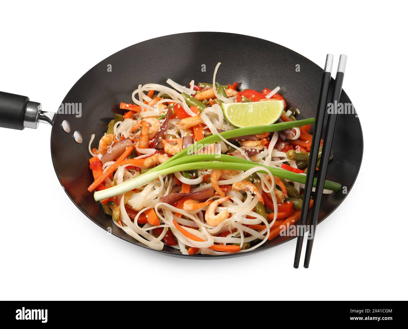 Shrimp stir fry with noodles and vegetables in wok isolated on white ...