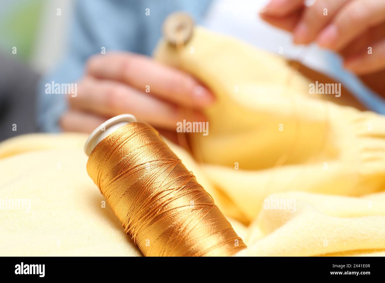 Woman spool thread sewing hi-res stock photography and images - Alamy