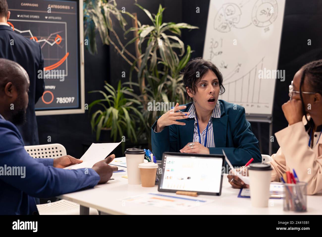 Forecast partners gathering statistics in a briefing conference ...